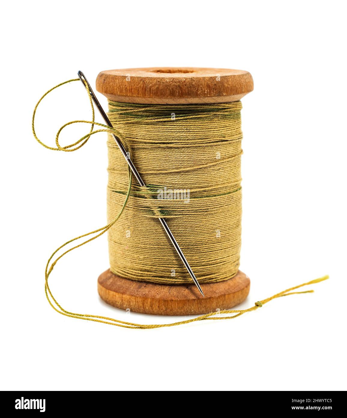 Vintage retro spool of thread on a white background. Needle with thread ...