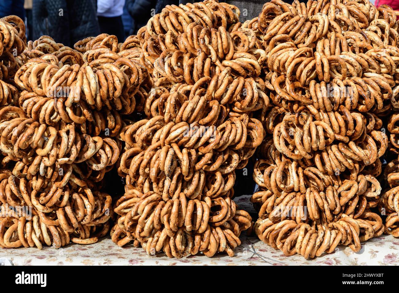 Fresh crispy pretzels or bagels, in direct sun light, displayed for ...