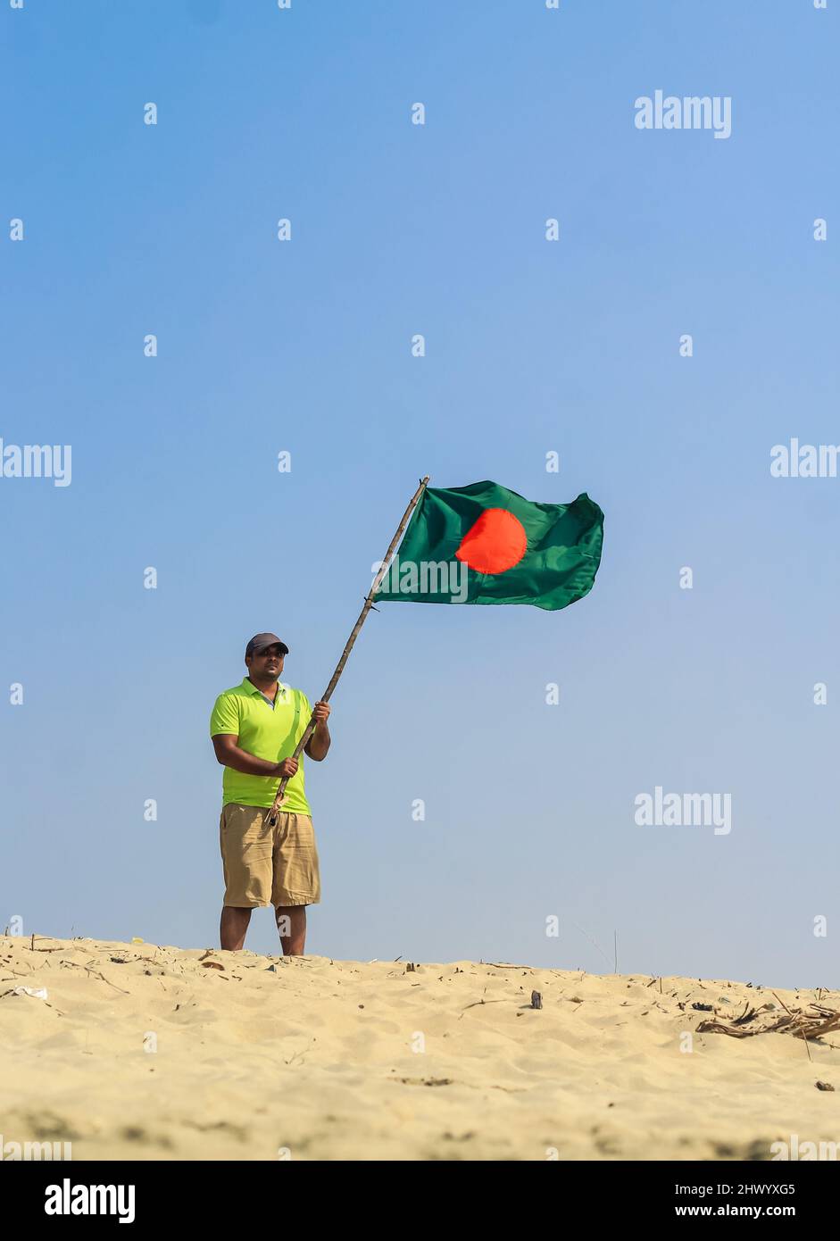 Bangladesh flag being waved by a man celebrating success. A beautiful ...