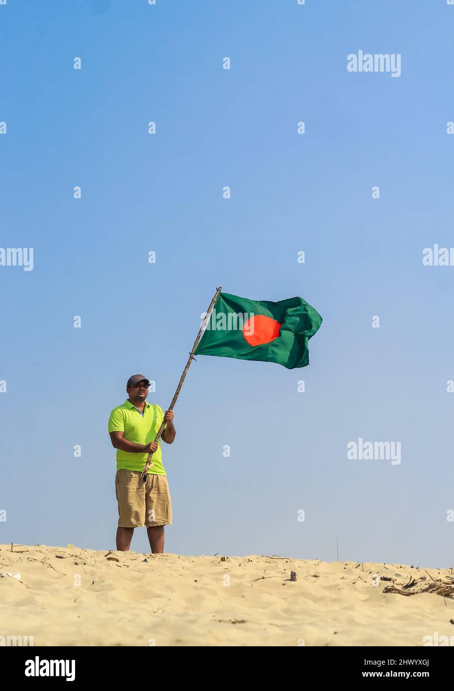 Bangladesh flag being waved by a man celebrating success. A beautiful ...