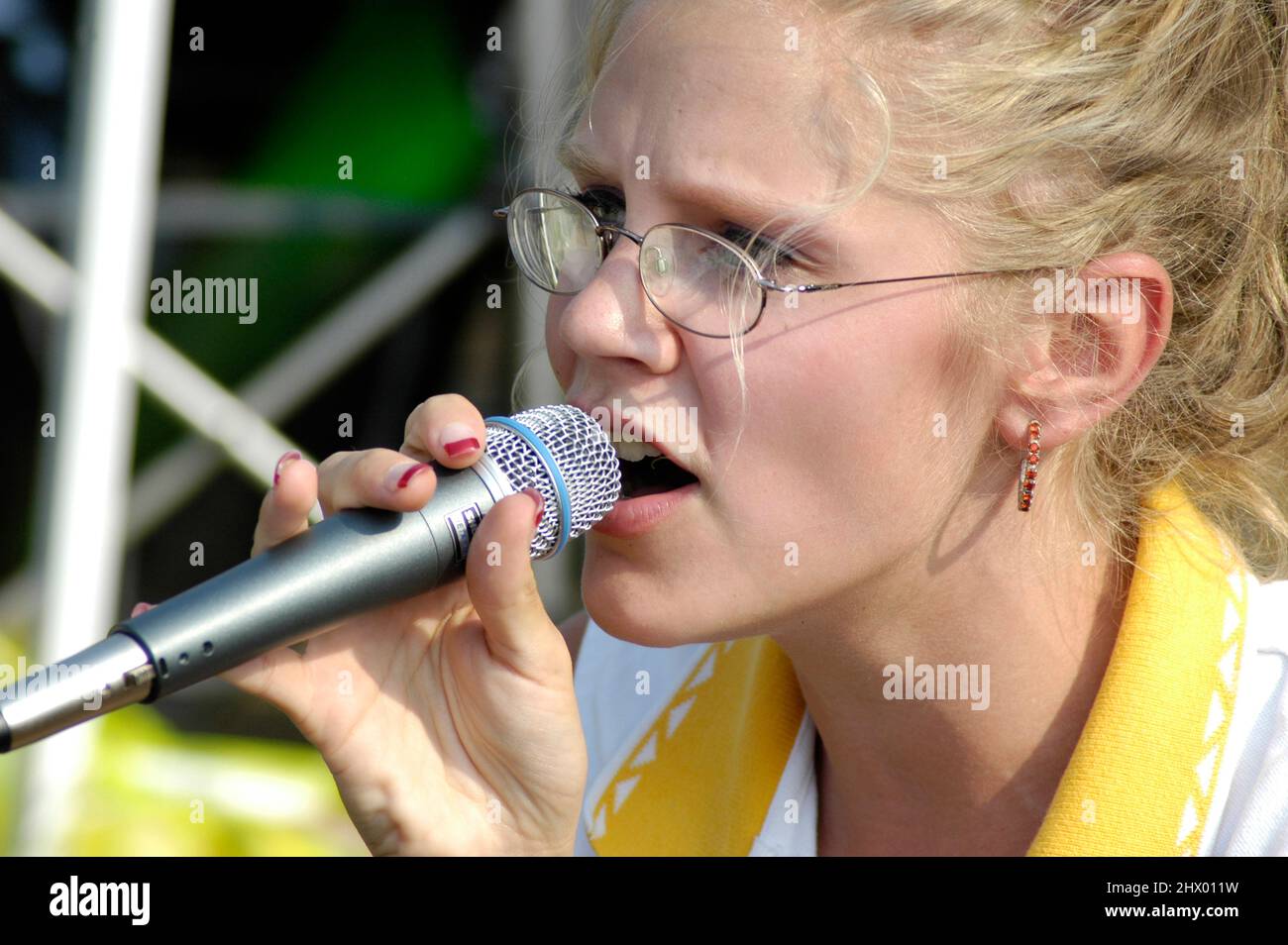 young white blond with glasses Teen singer with mic at fund raiser for ...