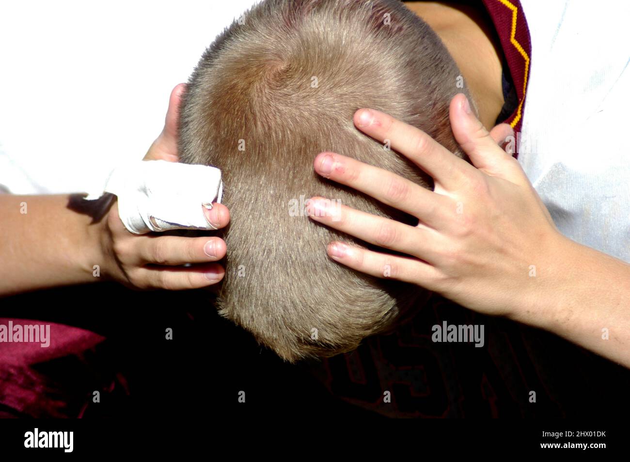 football game and hands and such of 11 and 12 year old players who are ...