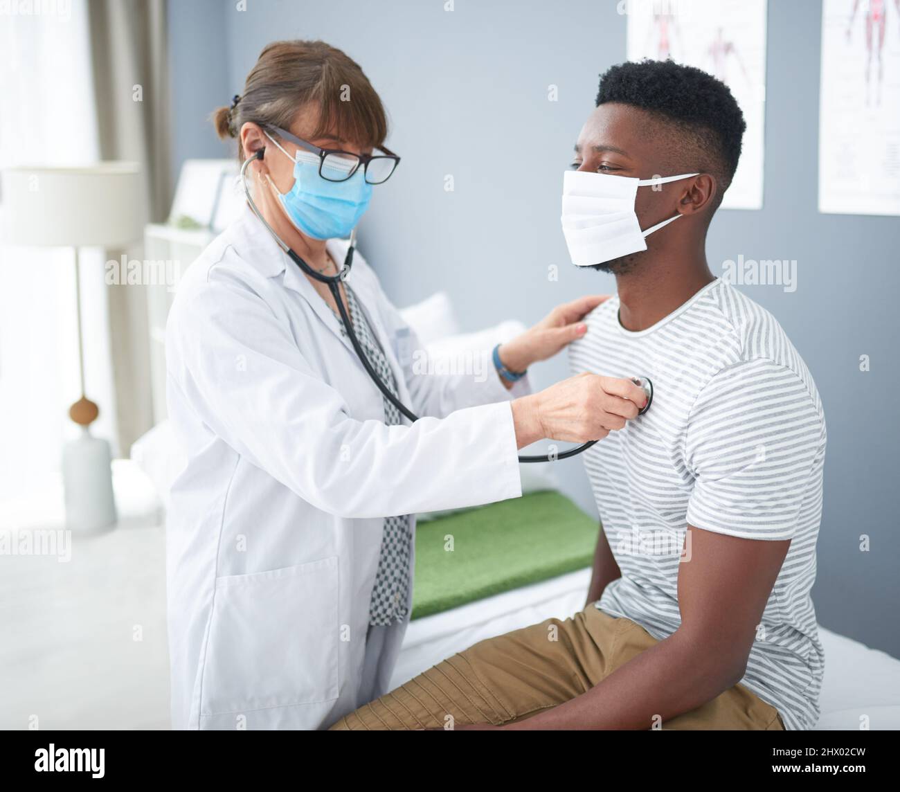 Your chest seems a bit tight today. Shot of a female doctor giving a ...