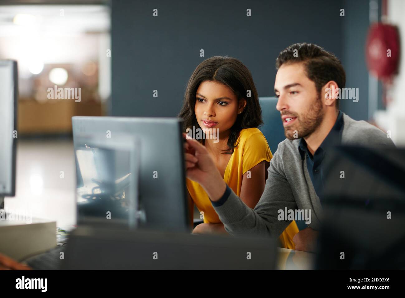 Giving his input. Cropped shot of two businesspeople working in the ...