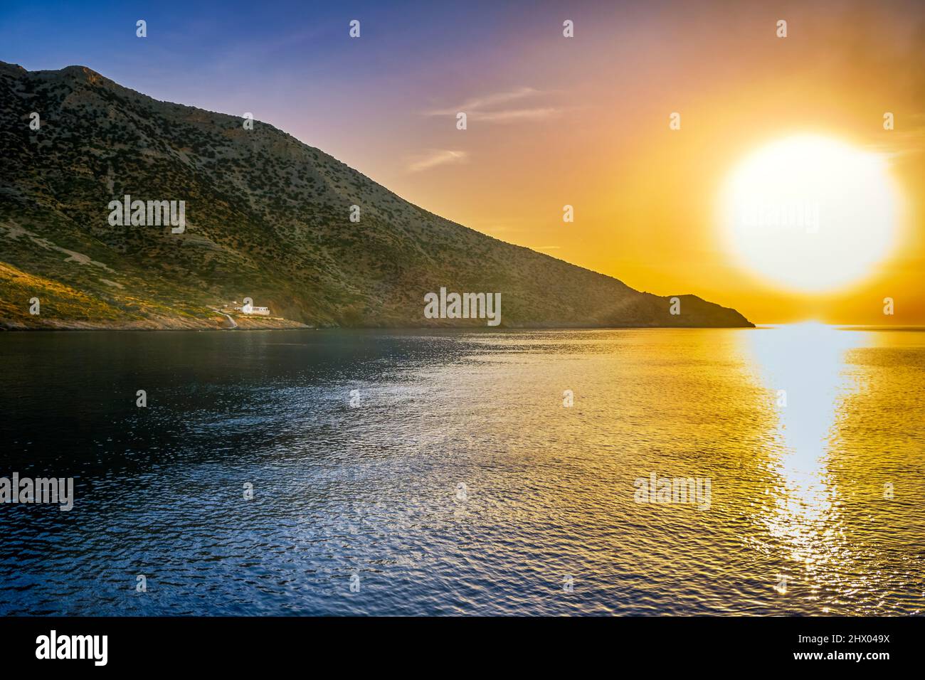 Beautiful view of Mediterranean island and its coast at sunset. Big low ...