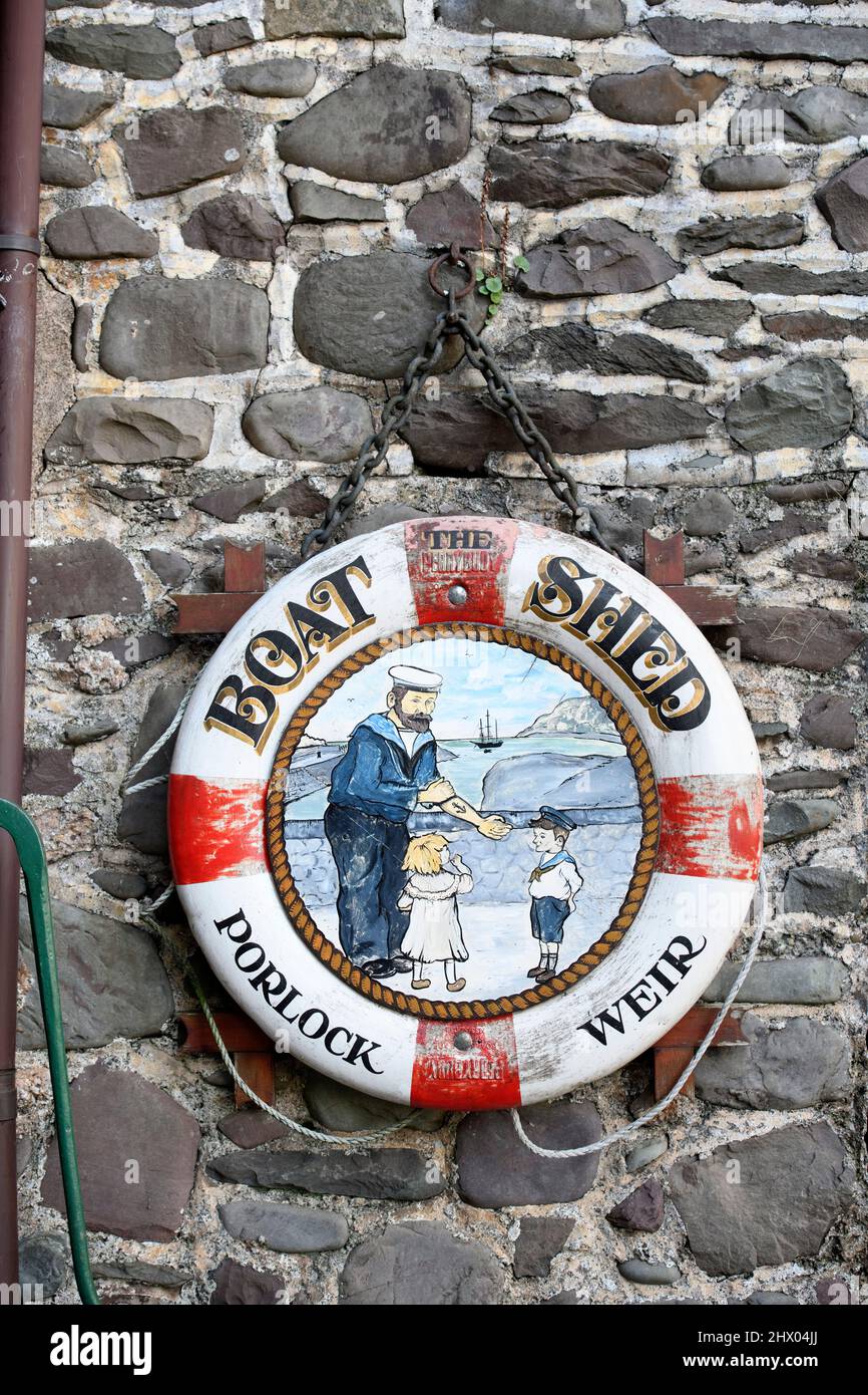 An old lifebuoy repurposed as a shop sign in Porlock Weir, Somerset, UK ...