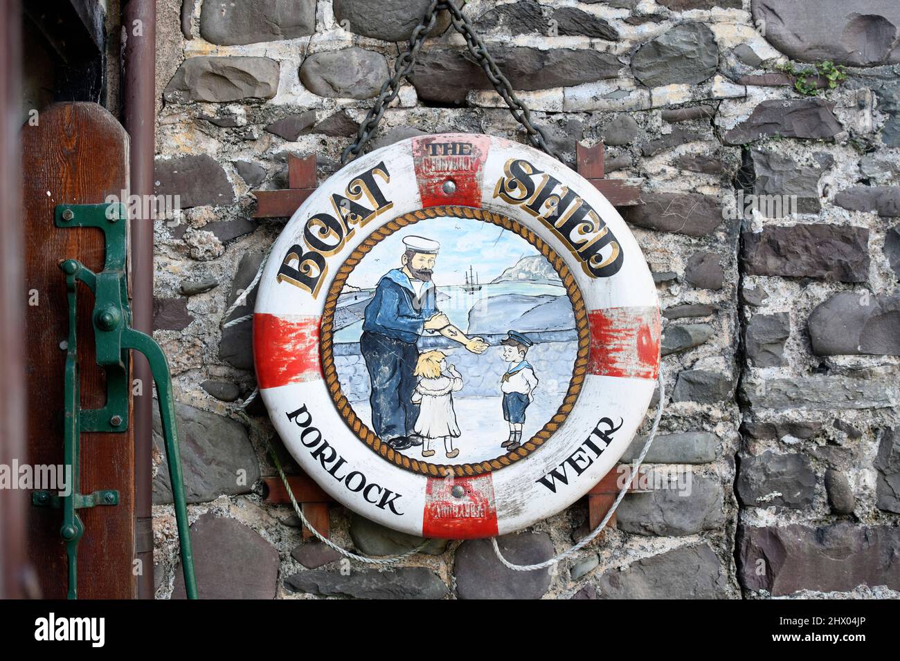 An old lifebuoy repurposed as a shop sign in Porlock Weir, Somerset, UK ...