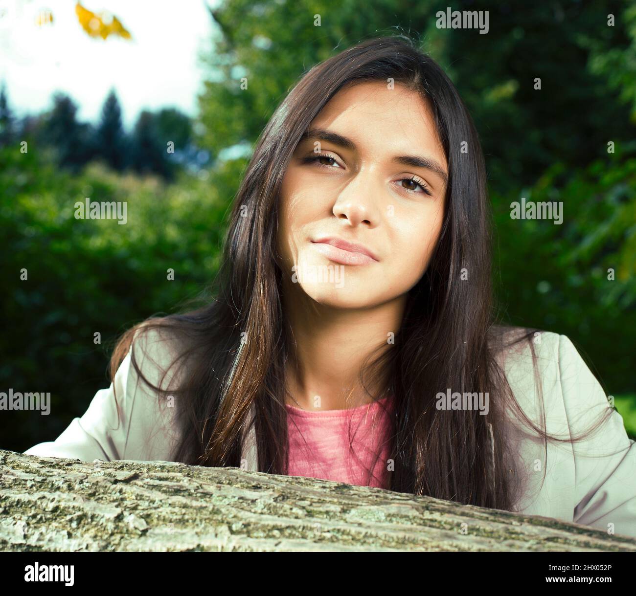 Young cute smiling real stylish dressed woman in green palm park ...