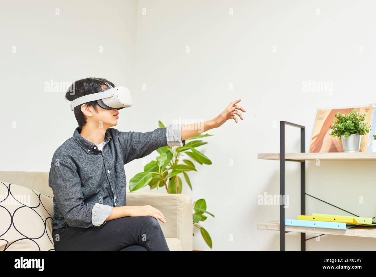 Japanese Man Wearing VR Goggles Stock Photo - Alamy