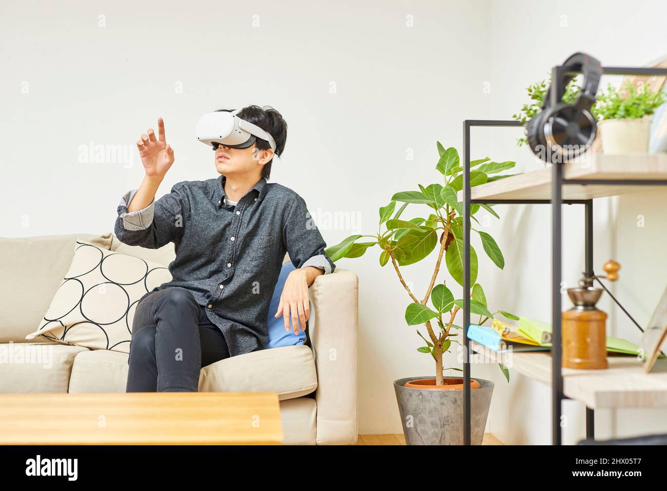 Japanese Man Wearing VR Goggles Stock Photo - Alamy