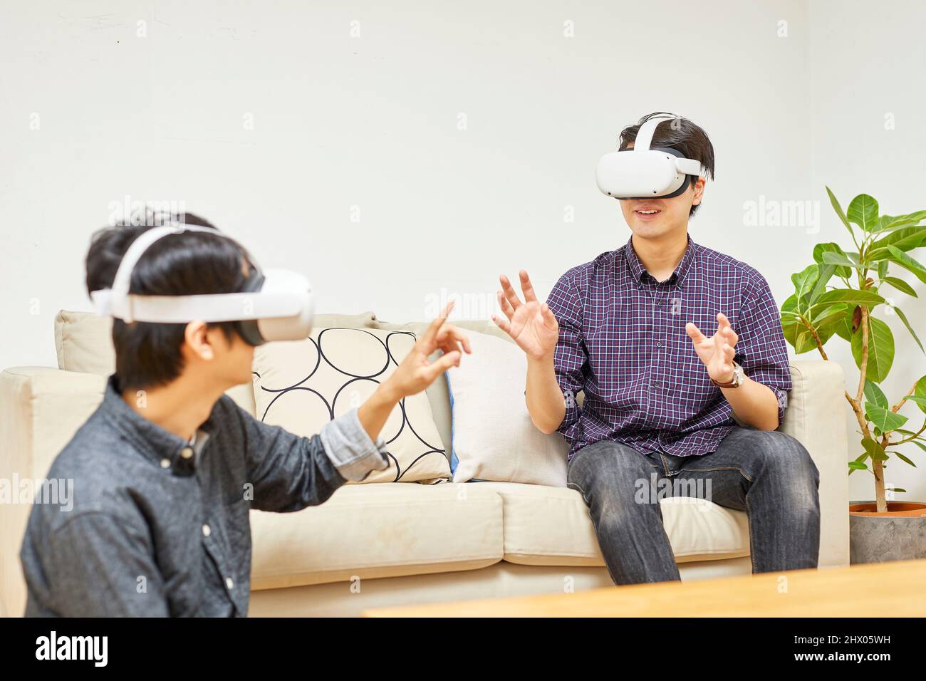 Japanese Men Wearing VR Goggles Stock Photo - Alamy