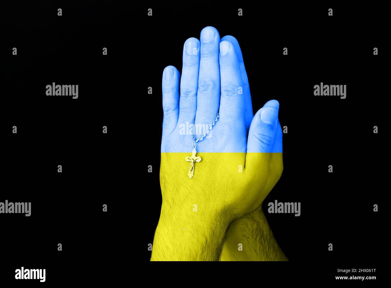 Prayer Hands in Pray Gesture painted in National flag of Ukraine yellow ...