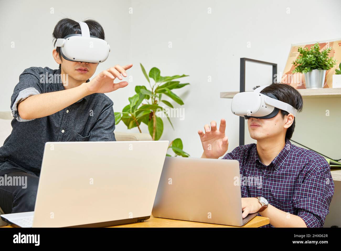 Japanese Men Wearing VR Goggles Stock Photo - Alamy