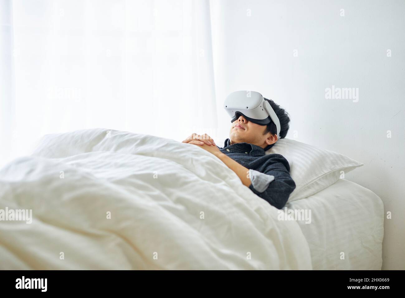 Japanese Man Wearing VR Goggles Stock Photo - Alamy