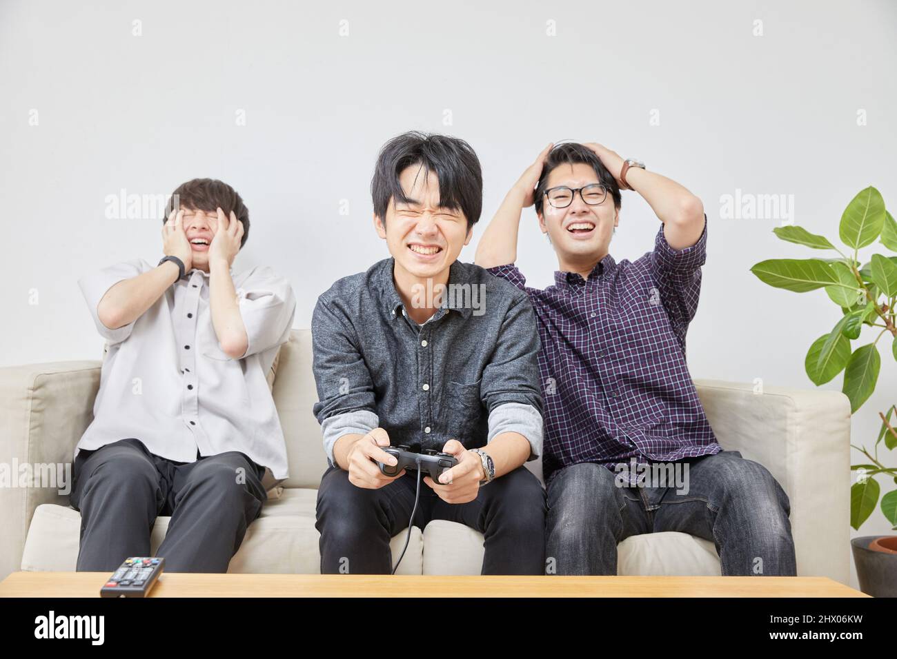 Japanese Men Playing Video Games Stock Photo - Alamy
