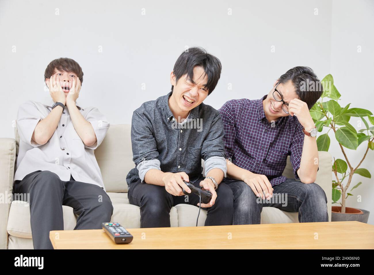 Japanese Men Playing Video Games Stock Photo - Alamy