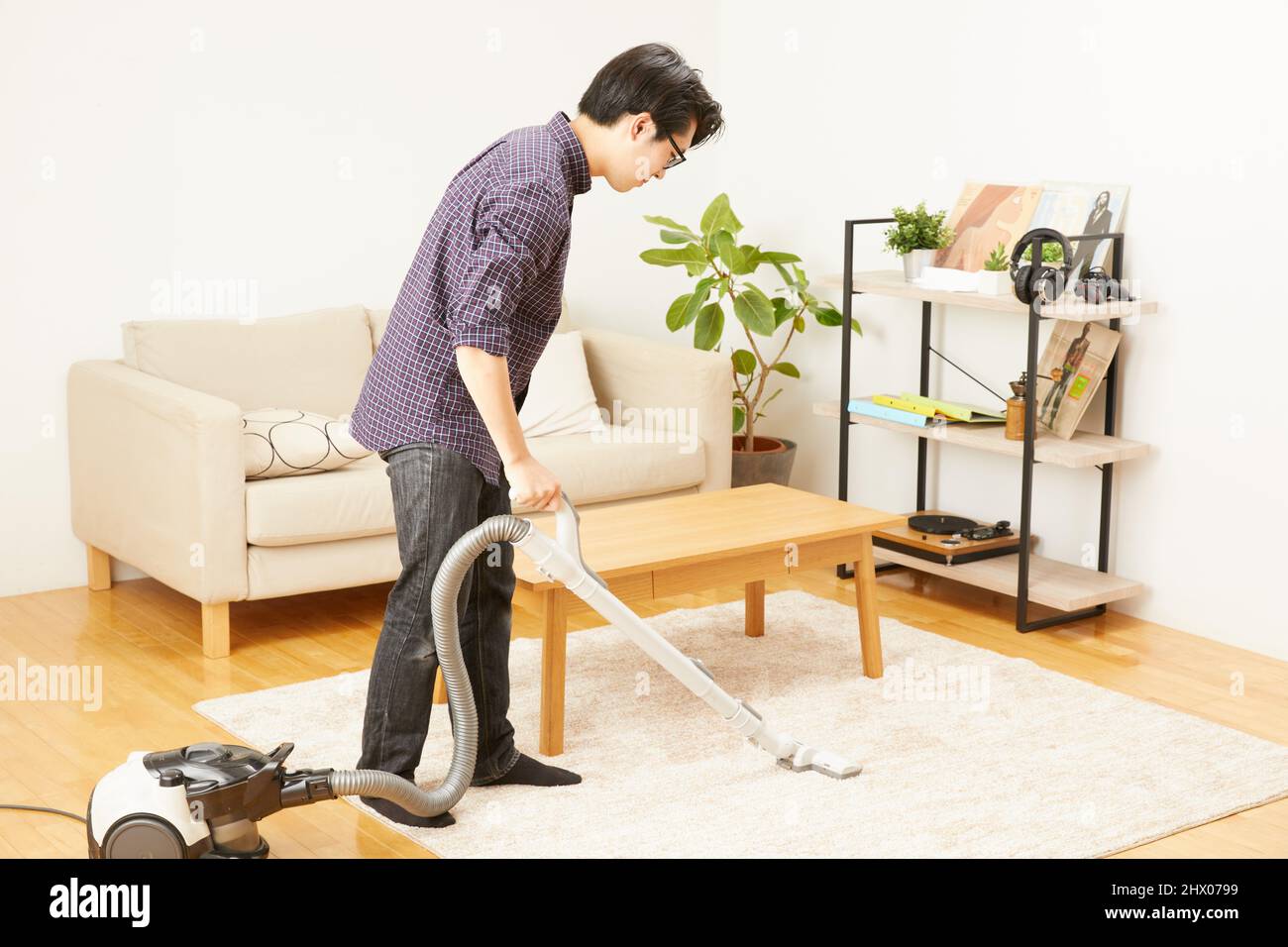 Japanese Man Cleaning The Room Stock Photo - Alamy