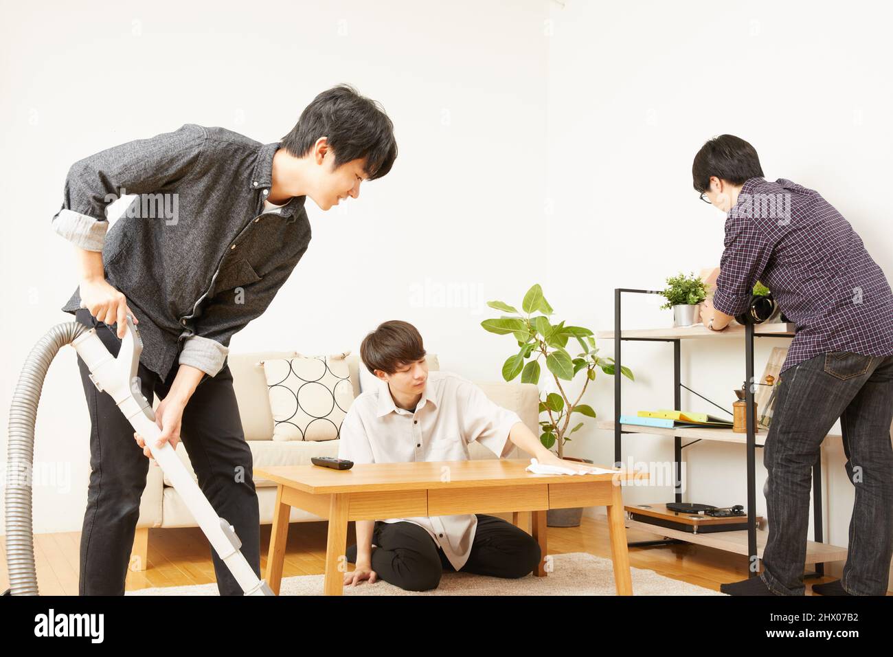 Japanese Men Cleaning The Room Stock Photo - Alamy