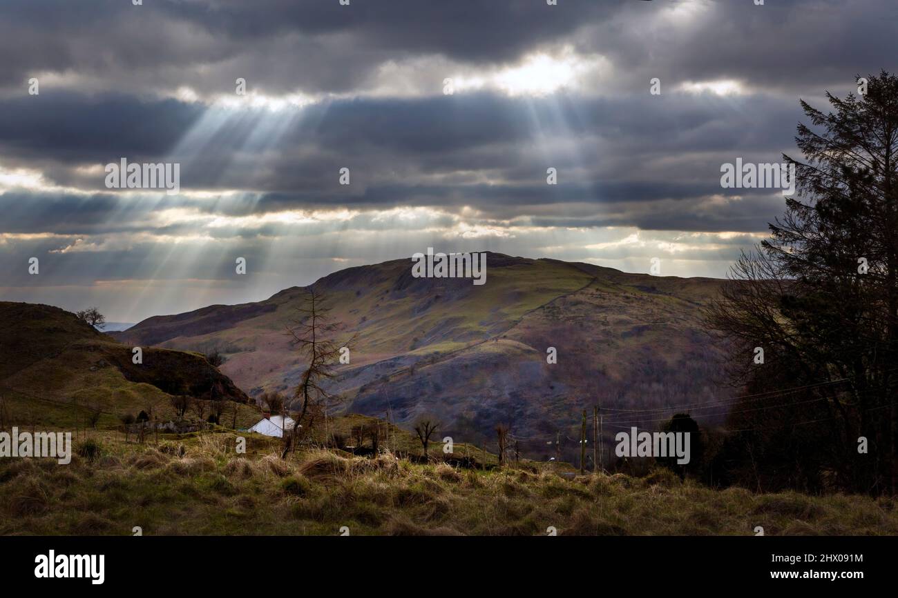 Cribarth mountain AKA The Sleeping Giant bathed in light shafts in the ...