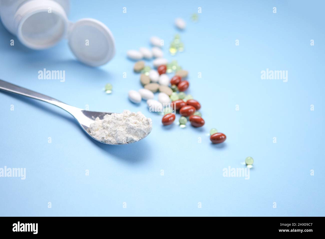 Nutritional supplements, vitamins and nutraceuticals on blue background ...