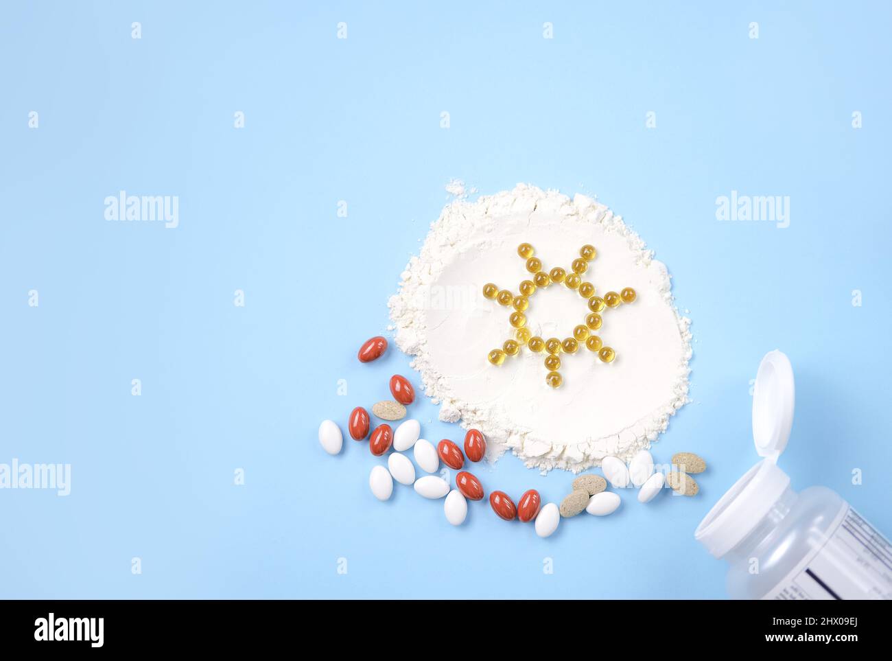 Nutritional supplements, vitamins and nutraceuticals on blue background ...