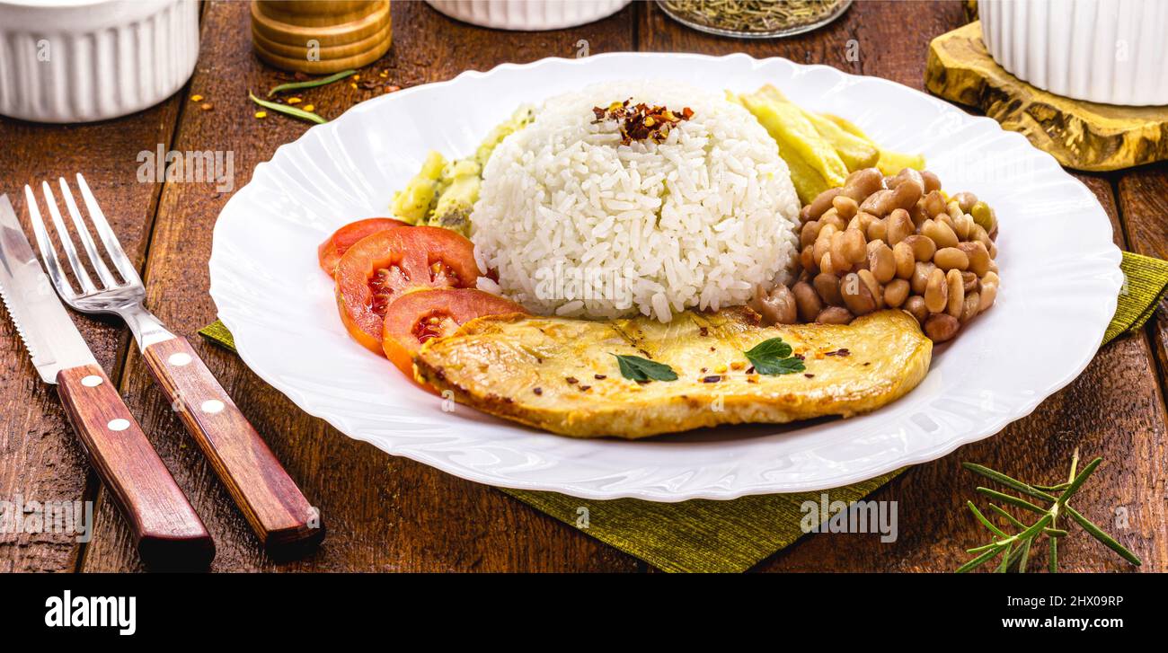 rice and beans served with french fries, grilled chicken fillet and ...