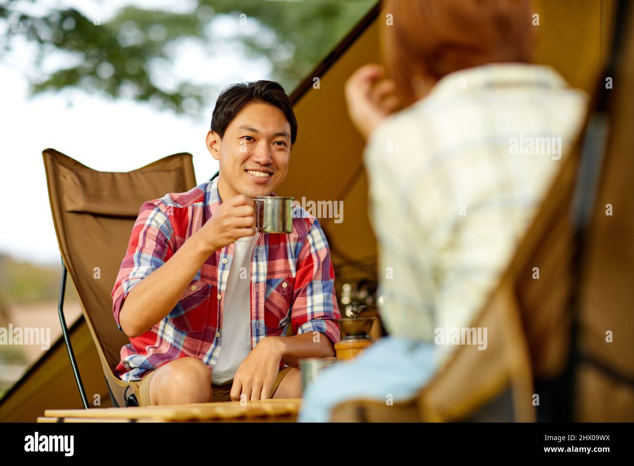 Japanese Couple At Campsite Stock Photo - Alamy