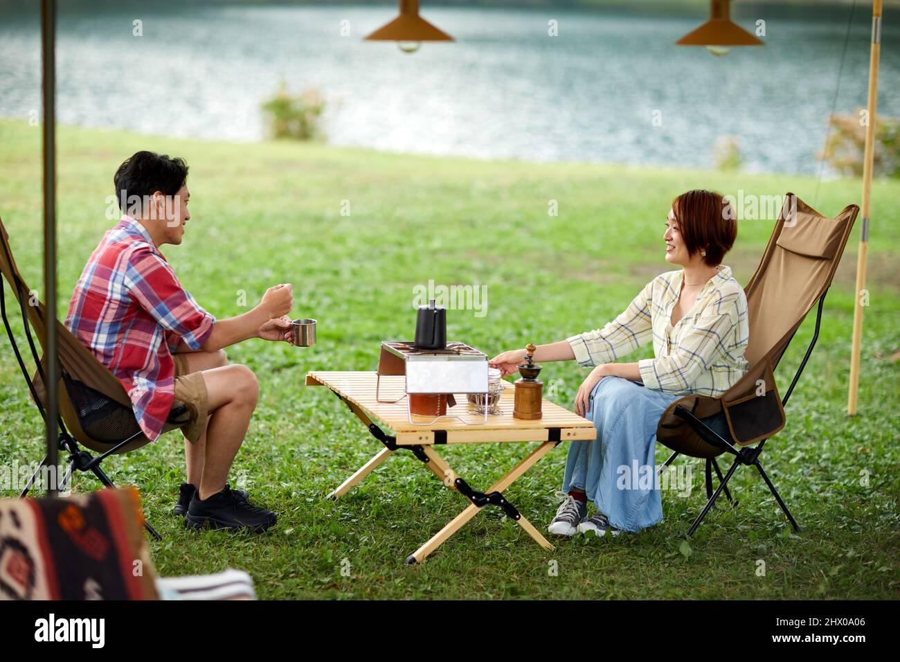 Japanese Couple At Campsite Stock Photo - Alamy
