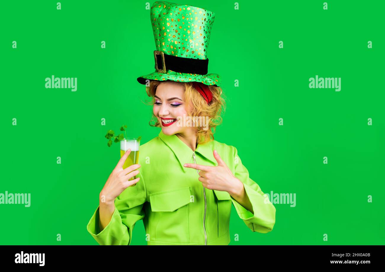 Saint Patricks Day. Smiling Woman in green hat with beer. Happy girl ...