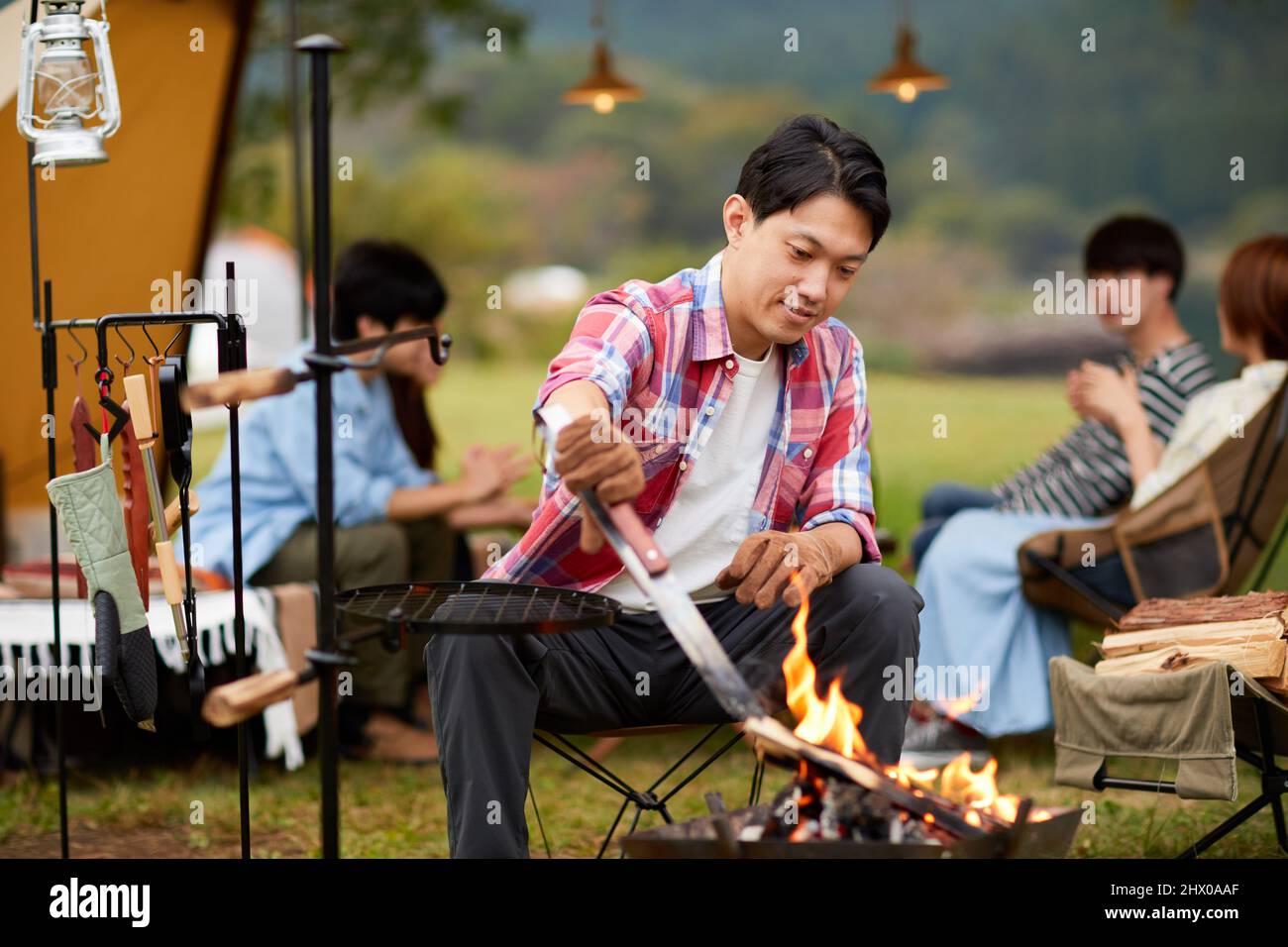 Japanese Men Making A Fire Stock Photo - Alamy