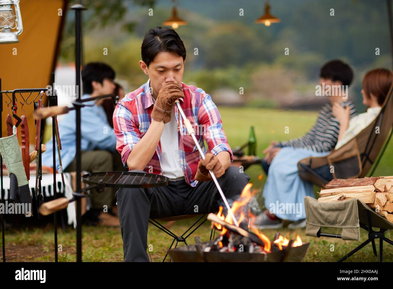 Japanese Men Making A Fire Stock Photo - Alamy