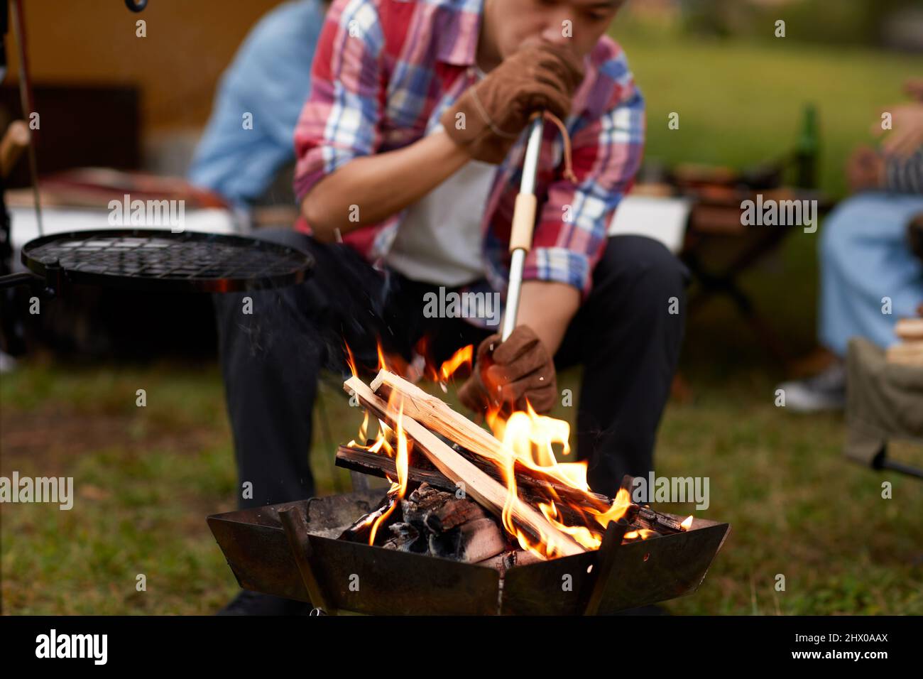 Japanese Men Making A Fire Stock Photo - Alamy