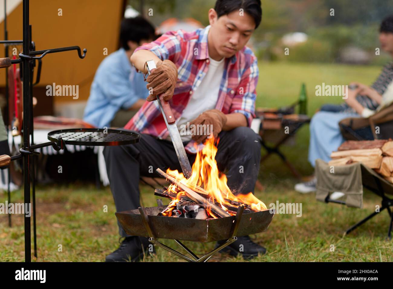 Japanese Men Making A Fire Stock Photo - Alamy