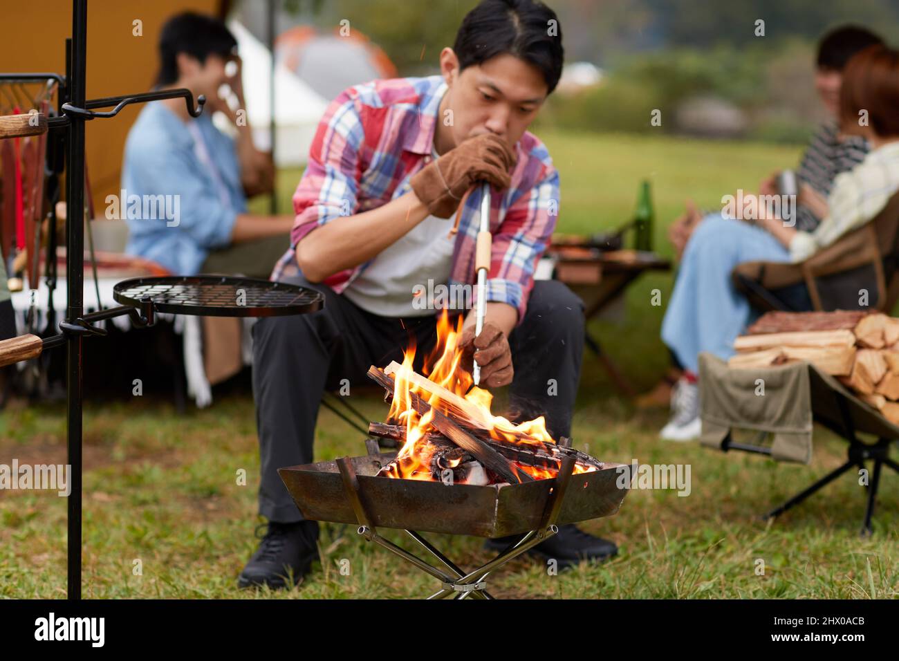 Japanese Men Making A Fire Stock Photo - Alamy
