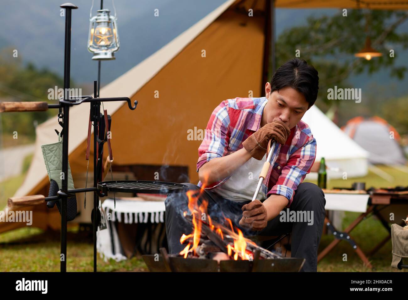 Japanese Man Making A Fire Stock Photo - Alamy