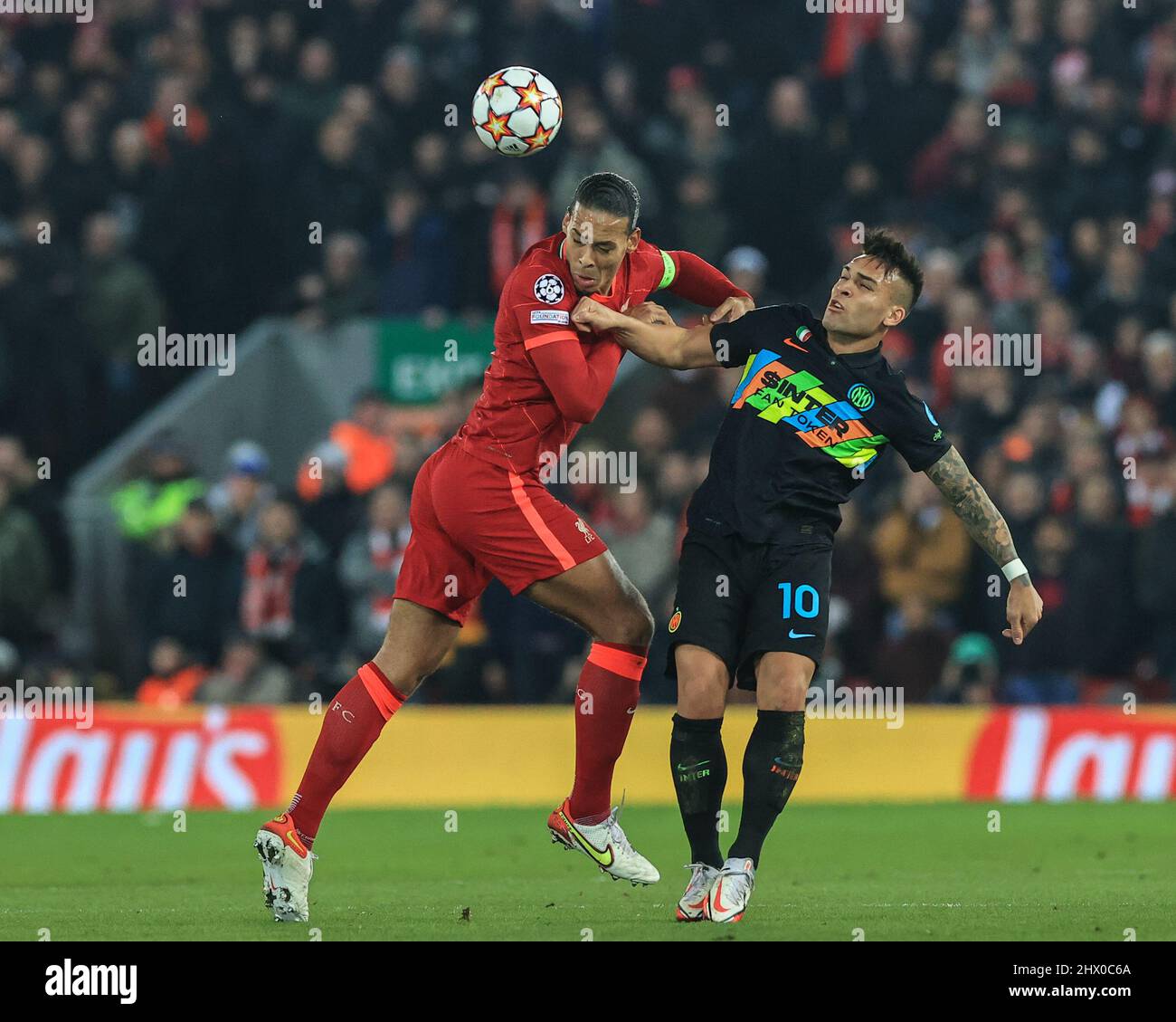 Virgil van Dijk #4 of Liverpool wins the header from Lautaro Martínez ...