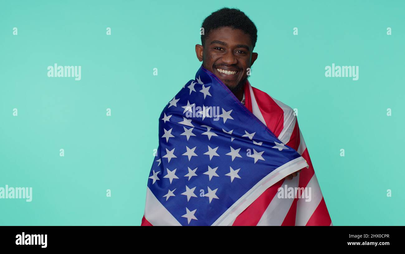 Man waving, wrapping in American USA flag, celebrating, human rights ...