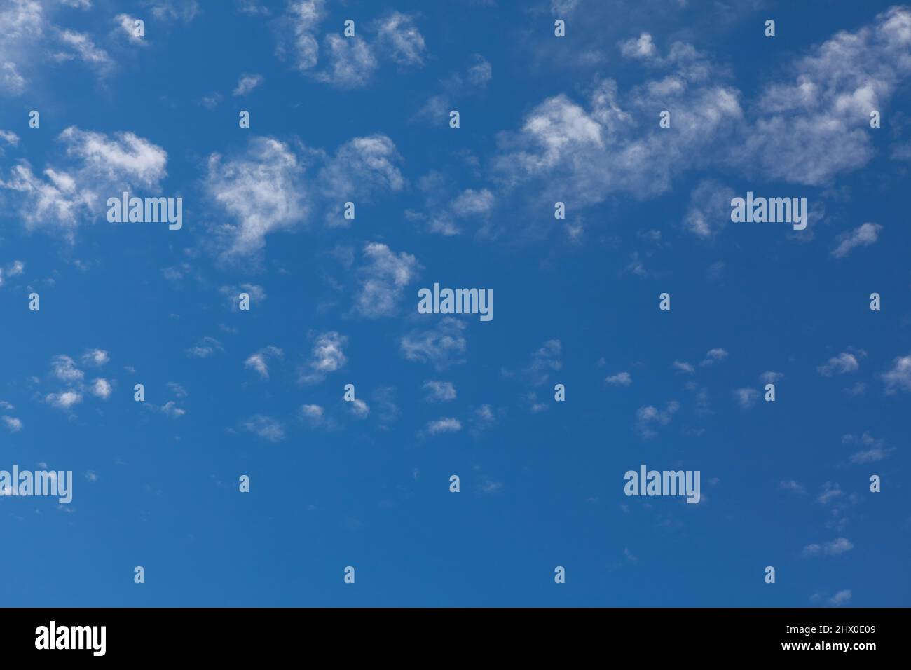 Blue sky with rare white clouds Stock Photo - Alamy