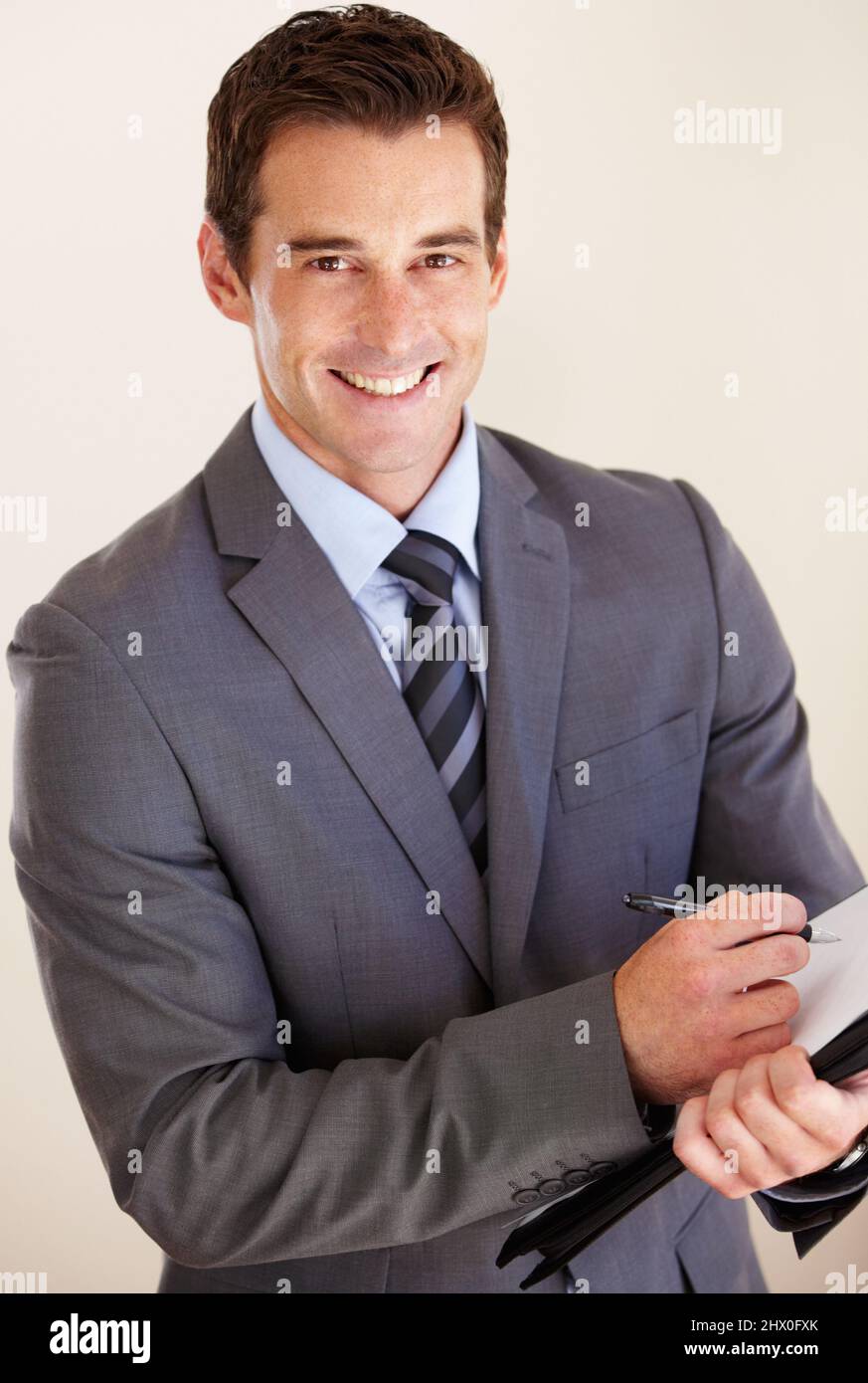 Handsome smiling businessmen making hi-res stock photography and images ...