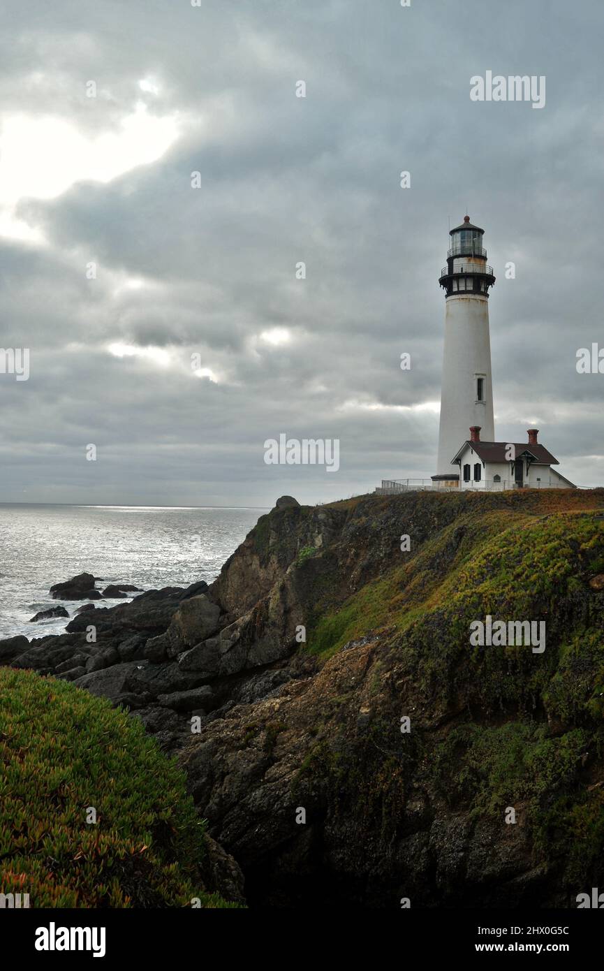 Historic 1871 Coast Guard Pigeon Point Lighthouse at cloudy sunset ...