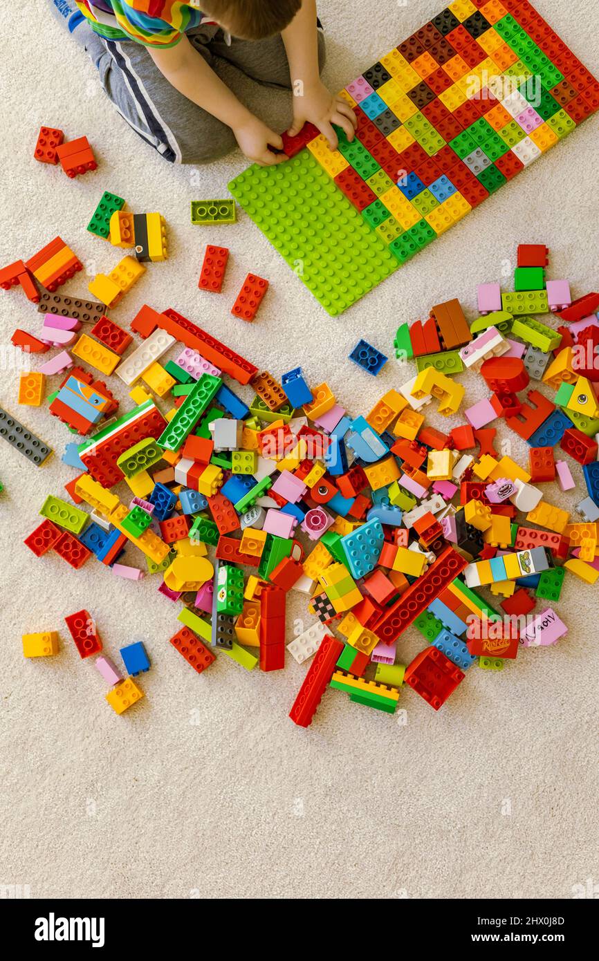 Khabarovsk, Russia, February 25, 2022. Top view cute baby boy playing ...