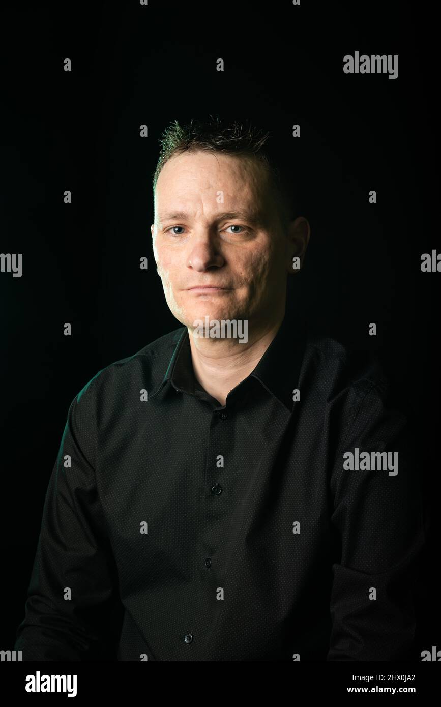 Portrait of a 42 year old business man, wearing a black shirt, Brussels ...