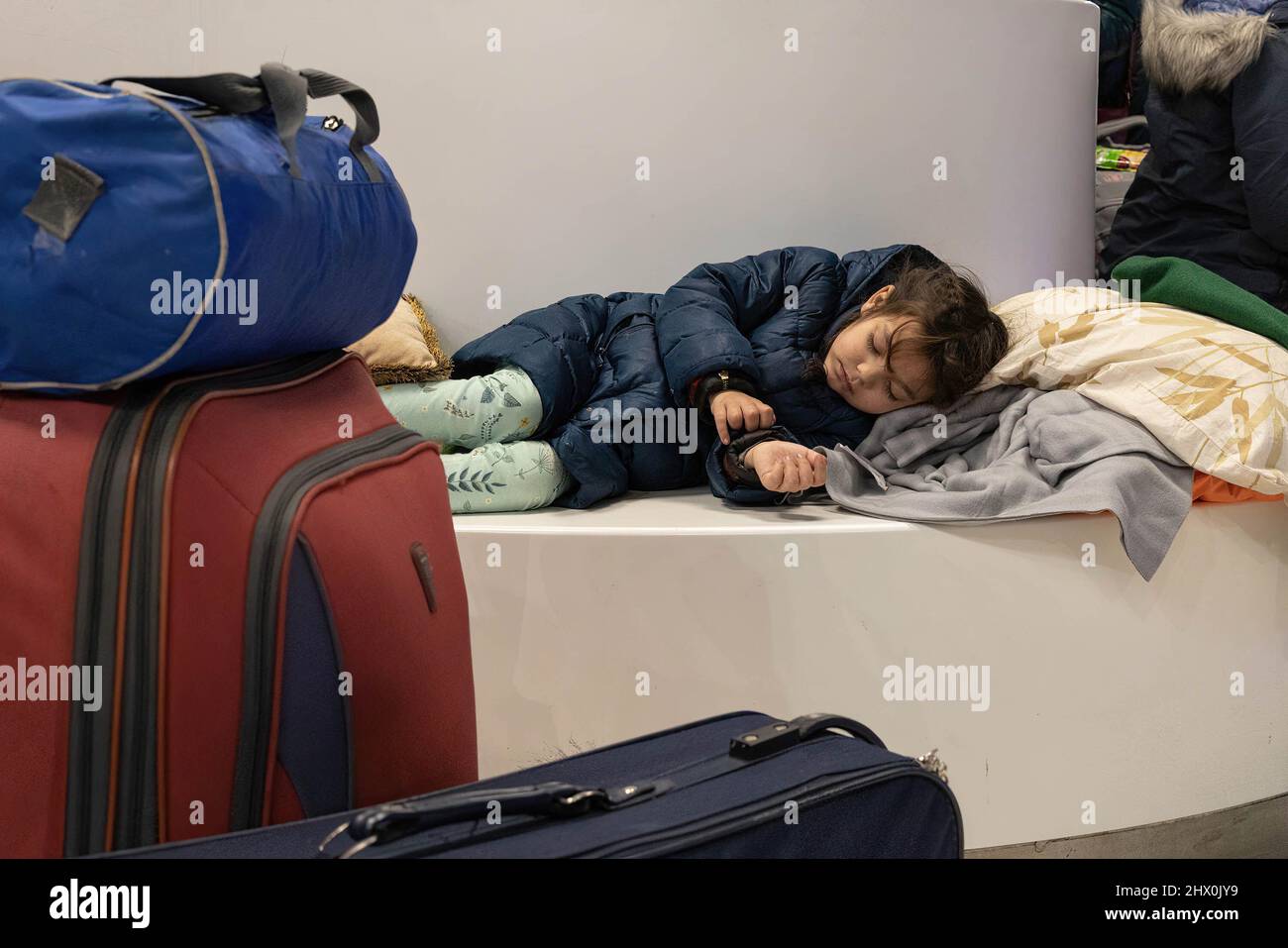 A young girl seen sleeping in Warszawa Centralna Railway Station after ...