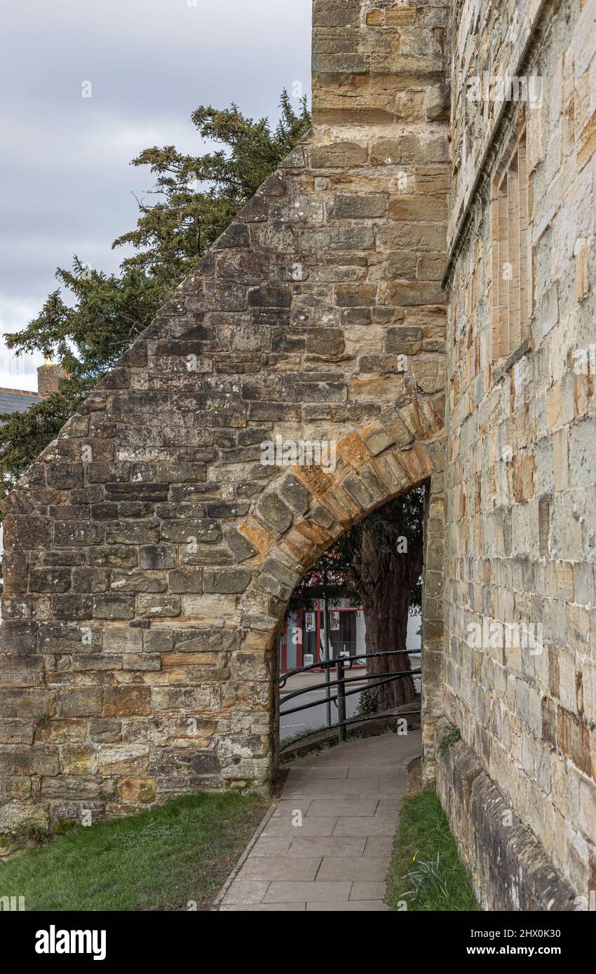 Support tower of ancient castle with an archway going through to the ...