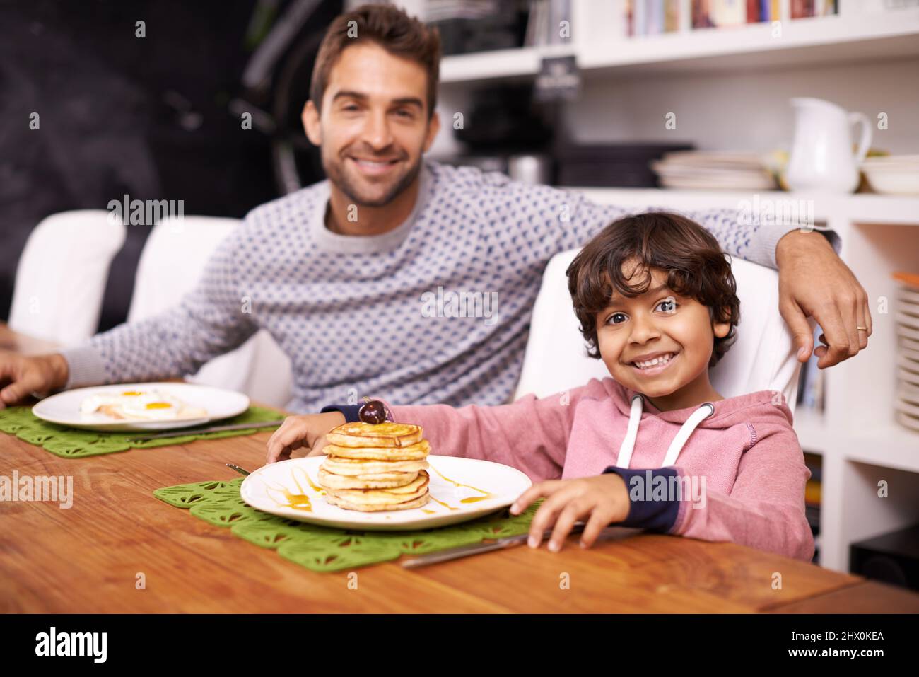Daddy makes the best pancakes. Portrait of a father and son having ...