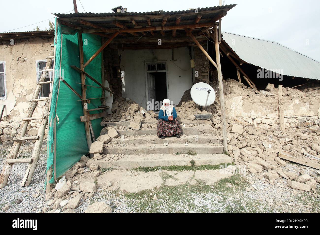 VAN, TURKEY - OCTOBER 25: Earthquake victim old woman in front of the ...