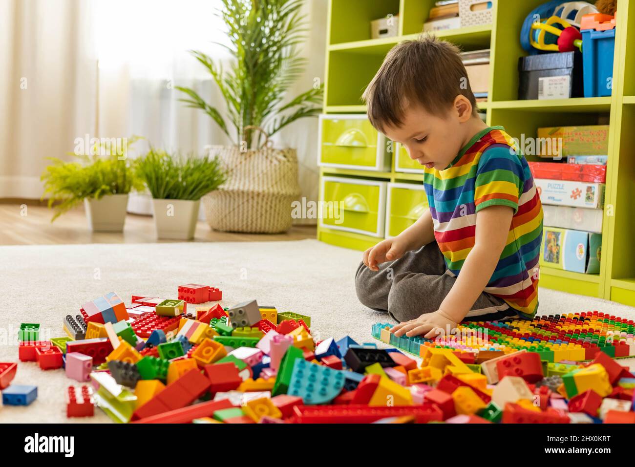 Khabarovsk, Russia, February 25, 2022. Top view cute baby boy playing ...