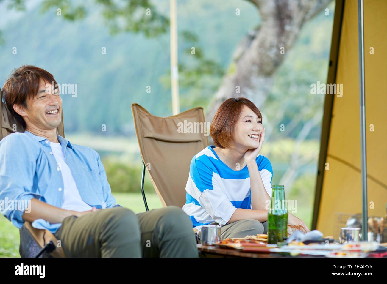 Japanese Couple At Campsite Stock Photo - Alamy