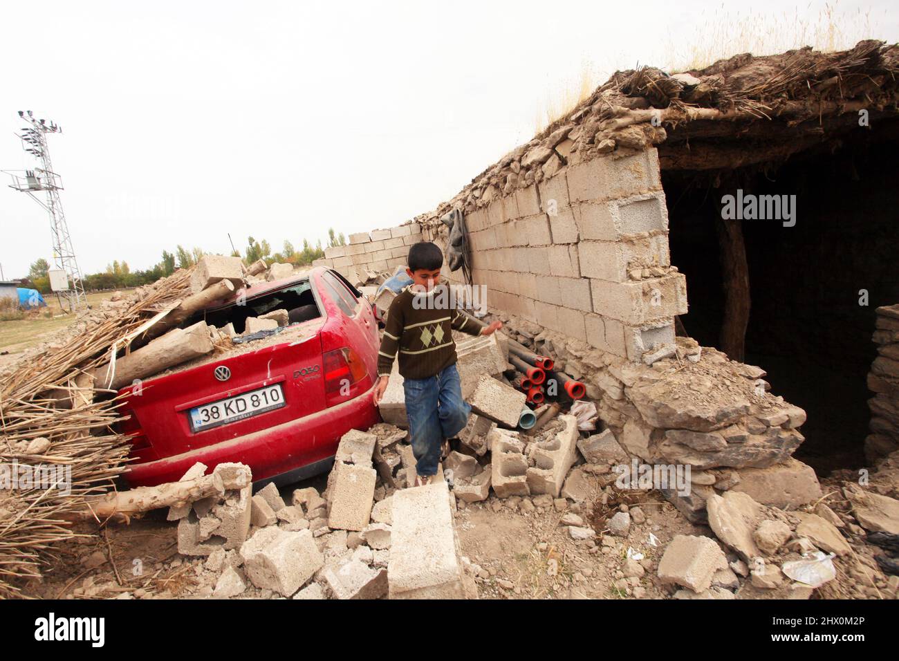 VAN, TURKEY - OCTOBER 25: Earthquake victim child in front of the their ...