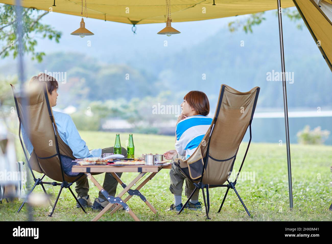 Japanese Couple At Campsite Stock Photo - Alamy